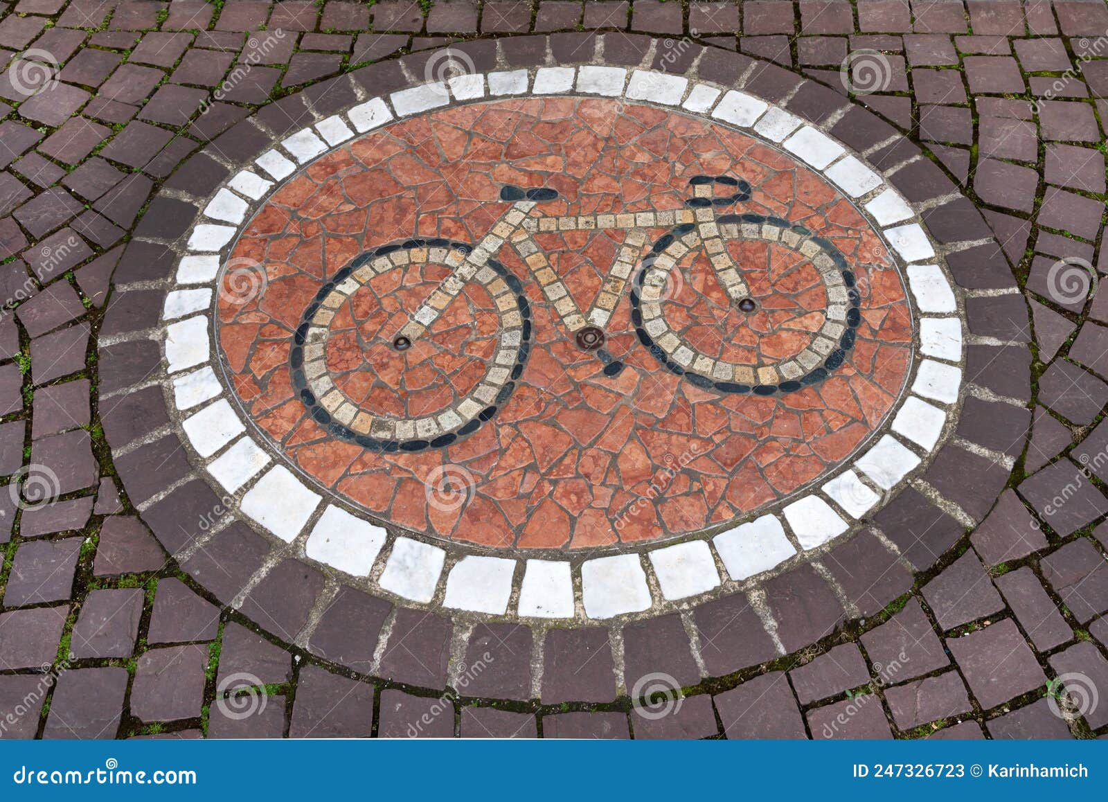 Round Bicycle Mosaic in a Sidewalk of Cobblestones. Bicycle Mosaic on a ...
