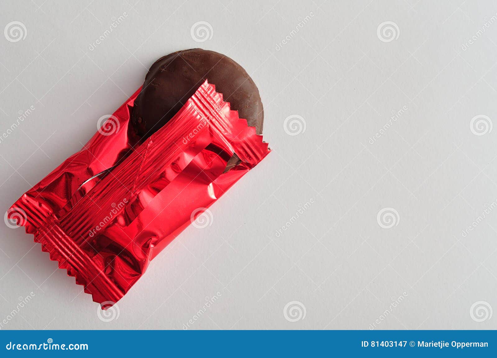 Round Biscuits Covered in Chocolate with a Red Wrapper Stock Image ...