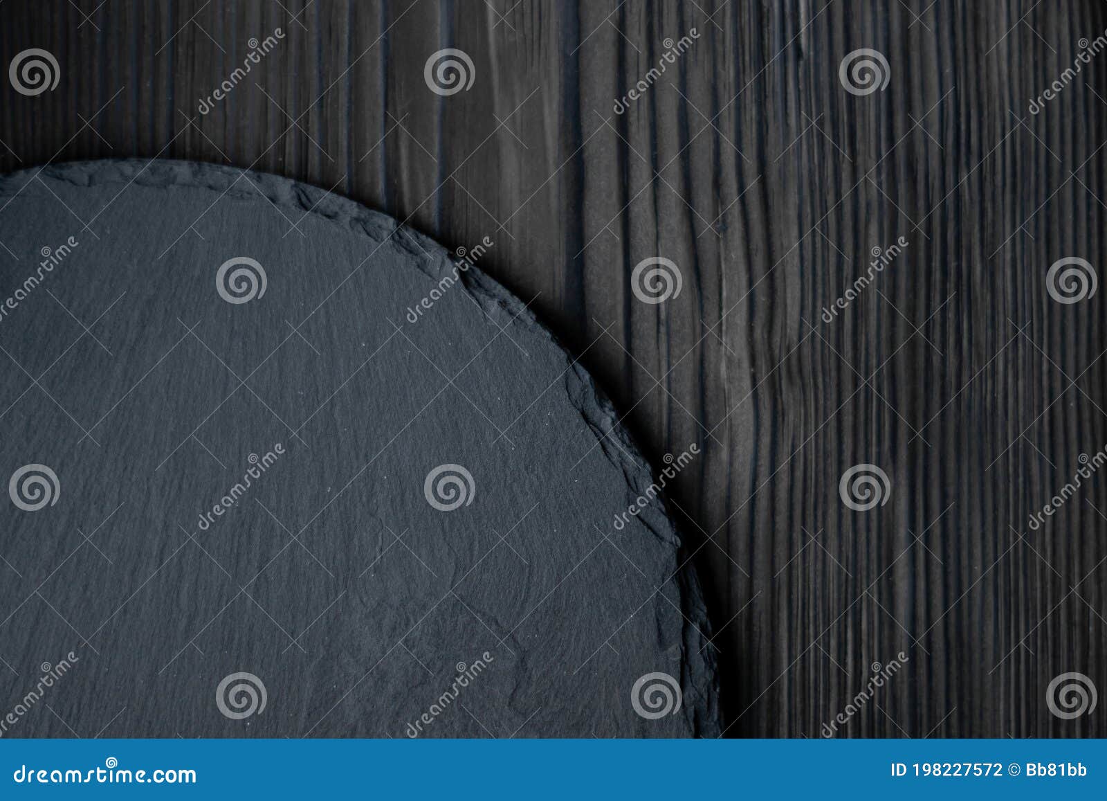 Round Black Slate Board on Wooden Table Stock Photo - Image of empty ...