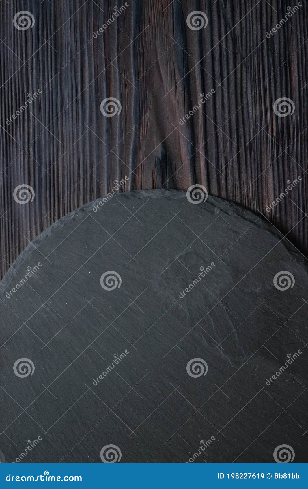 Round Black Slate Board on Wooden Table Stock Image - Image of cutting ...