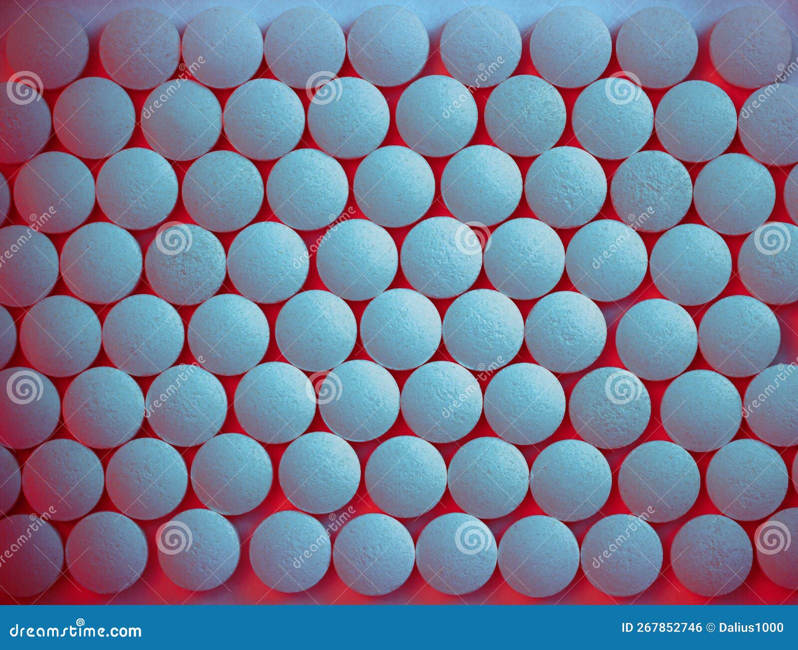 Round Blue Pills on a Flat Surface - Red Shining Background Stock Photo ...