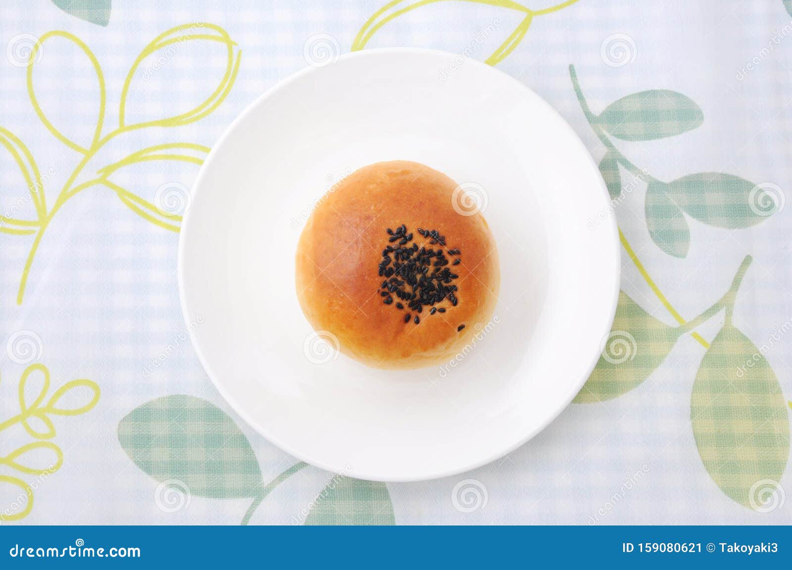Round Bread with Sesame on Plate on Table Cloth Stock Image - Image of ...