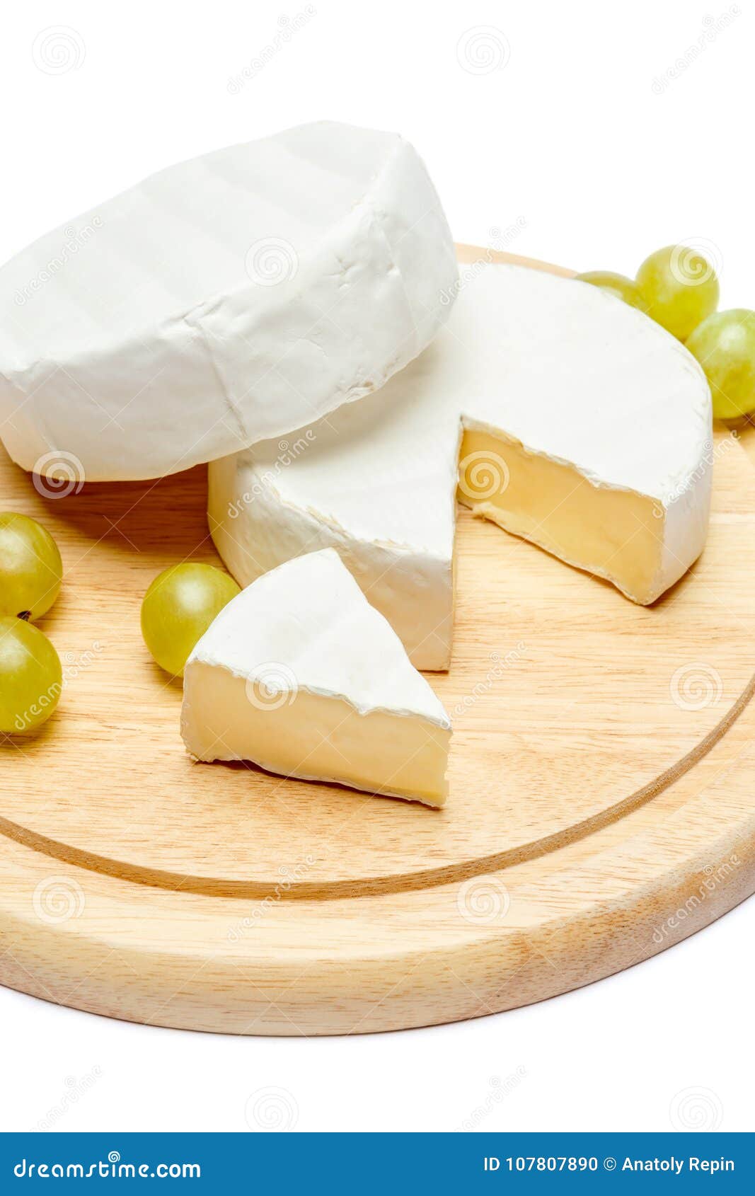 Round Brie or Camambert Cheese on Cutting Board White Background Stock ...