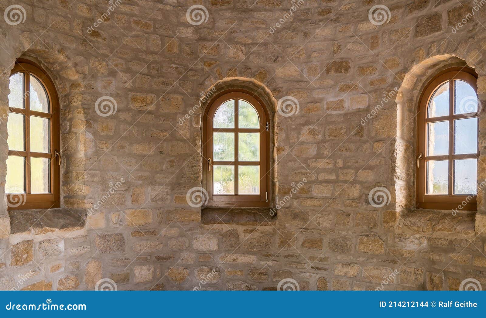 Three Renovated Lattice Windows Bordered in a Natural Stone Wall Stock ...