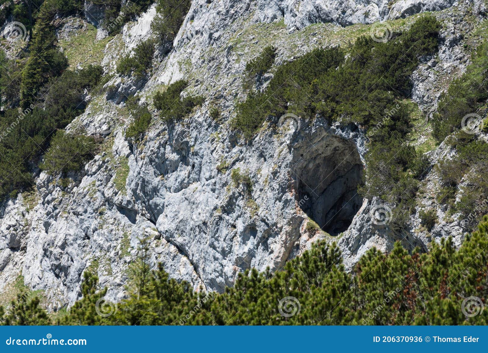Round Cave in a Mountain with Plants Stock Photo - Image of helmet ...