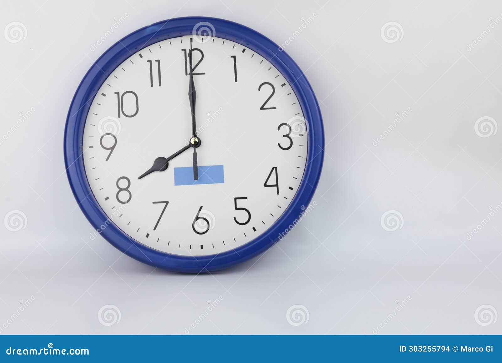 Blue Wall Clock Stopped at 8 Stock Photo - Image of middle, hands ...