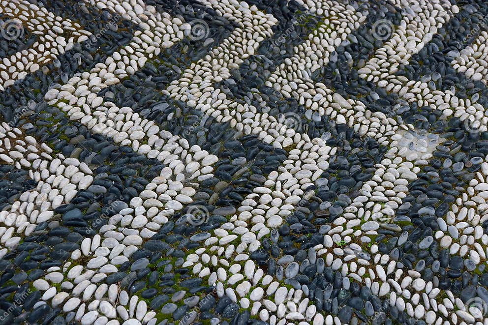 Round Cobblestone Rocks Creating a Chevron Pattern Stock Photo - Image ...