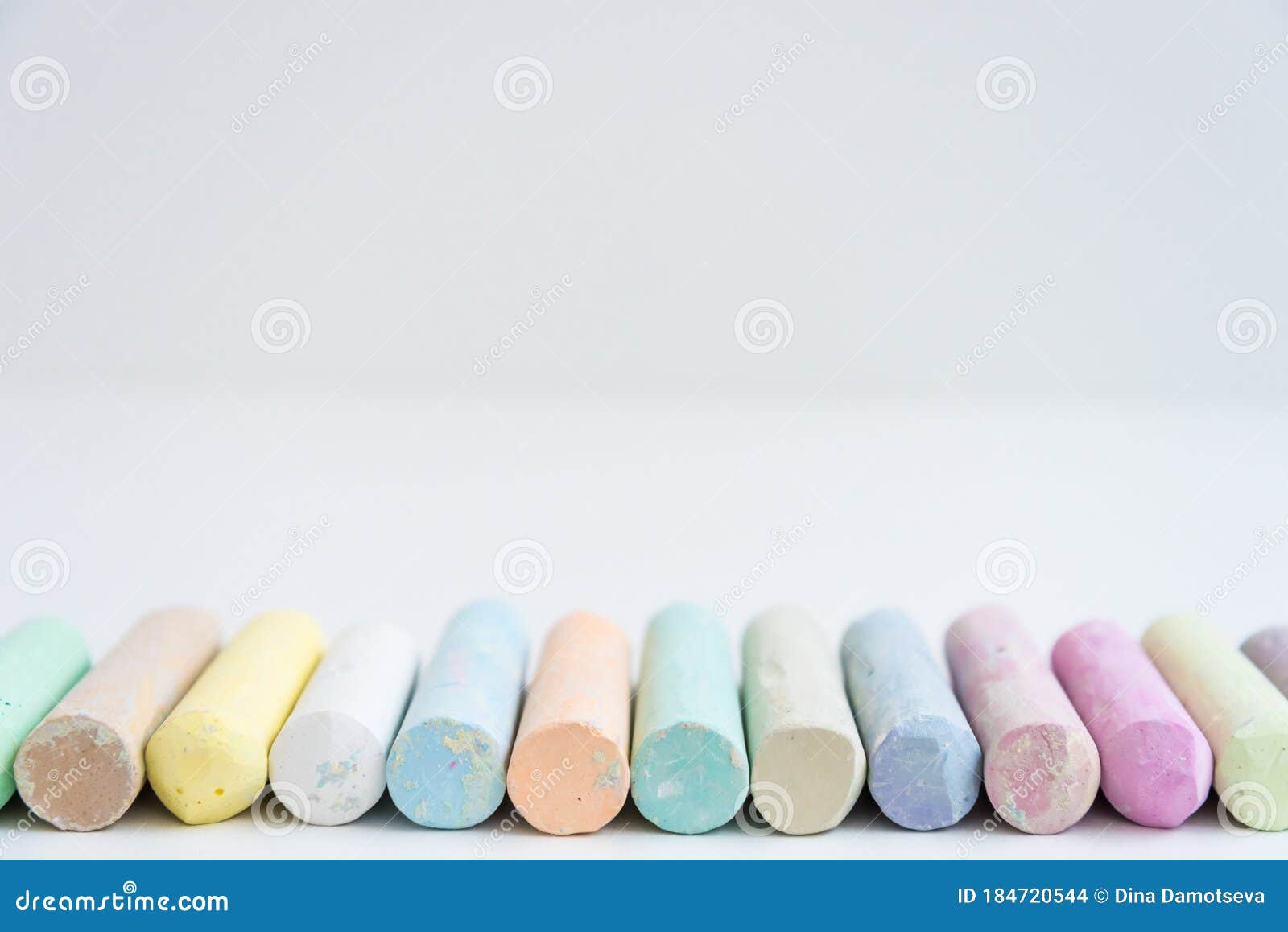 Round Colored Crayons are Arranged in a Row. Front View. White ...