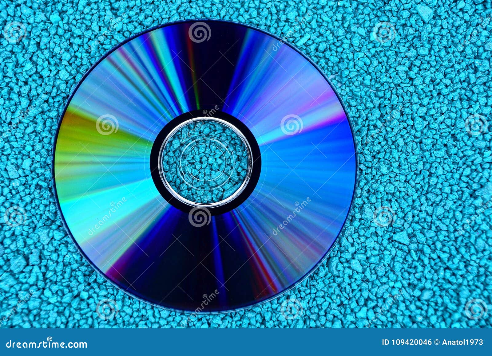 Round Compact Disc on Small Green Stones Stock Photo - Image of disk ...