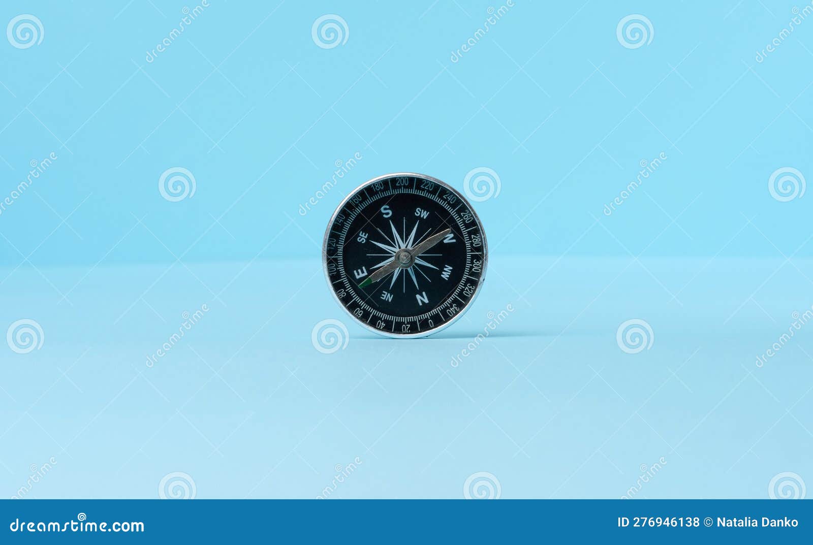 Round Compass on a Blue Background Stock Photo - Image of compass ...