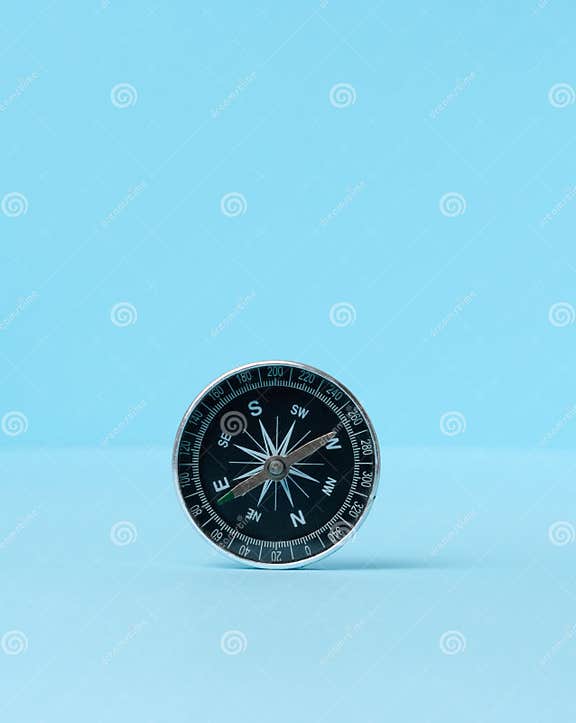Round Compass on a Blue Background Stock Image - Image of device, metal ...