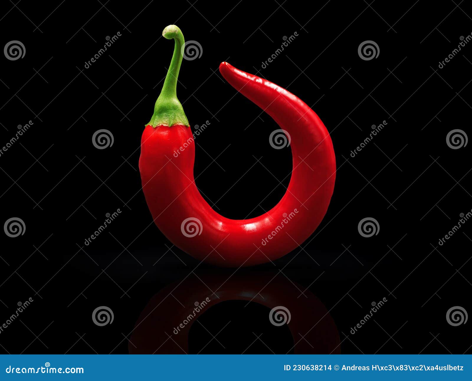 Round Curved Red Chili Pepper Isolated on Black Background Stock Photo ...