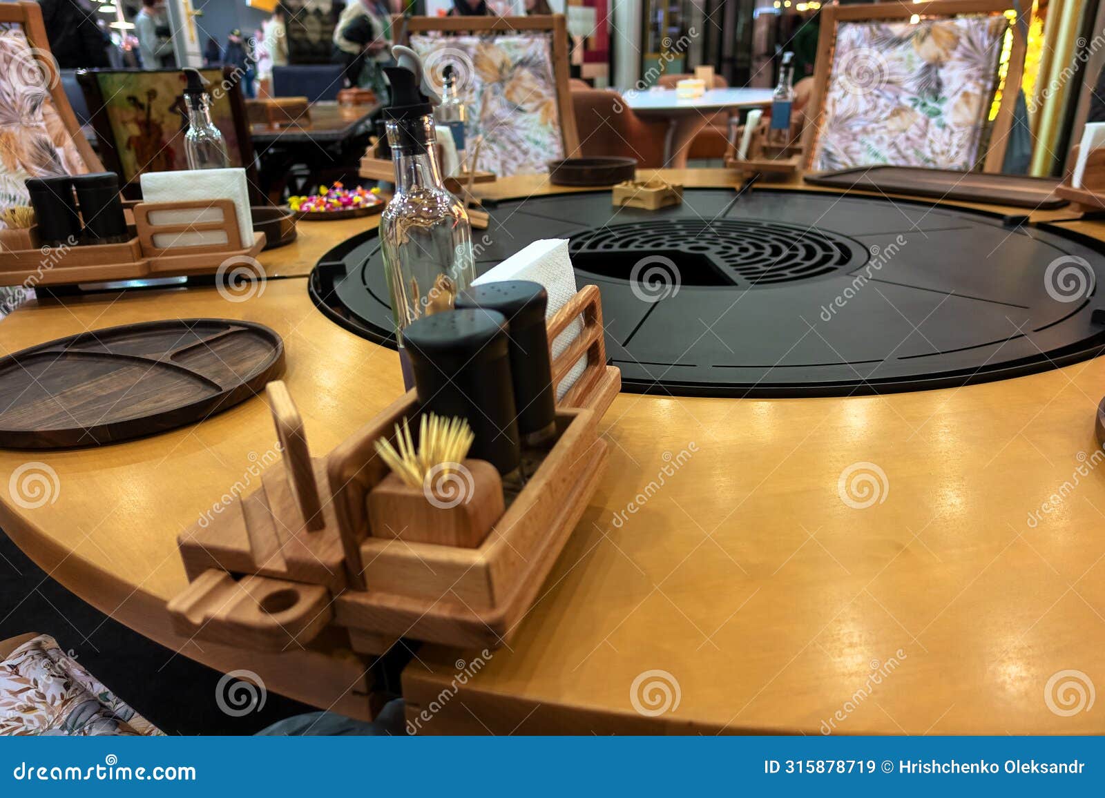 Round Dining Table with Round Grill Inside Stock Image - Image of ...