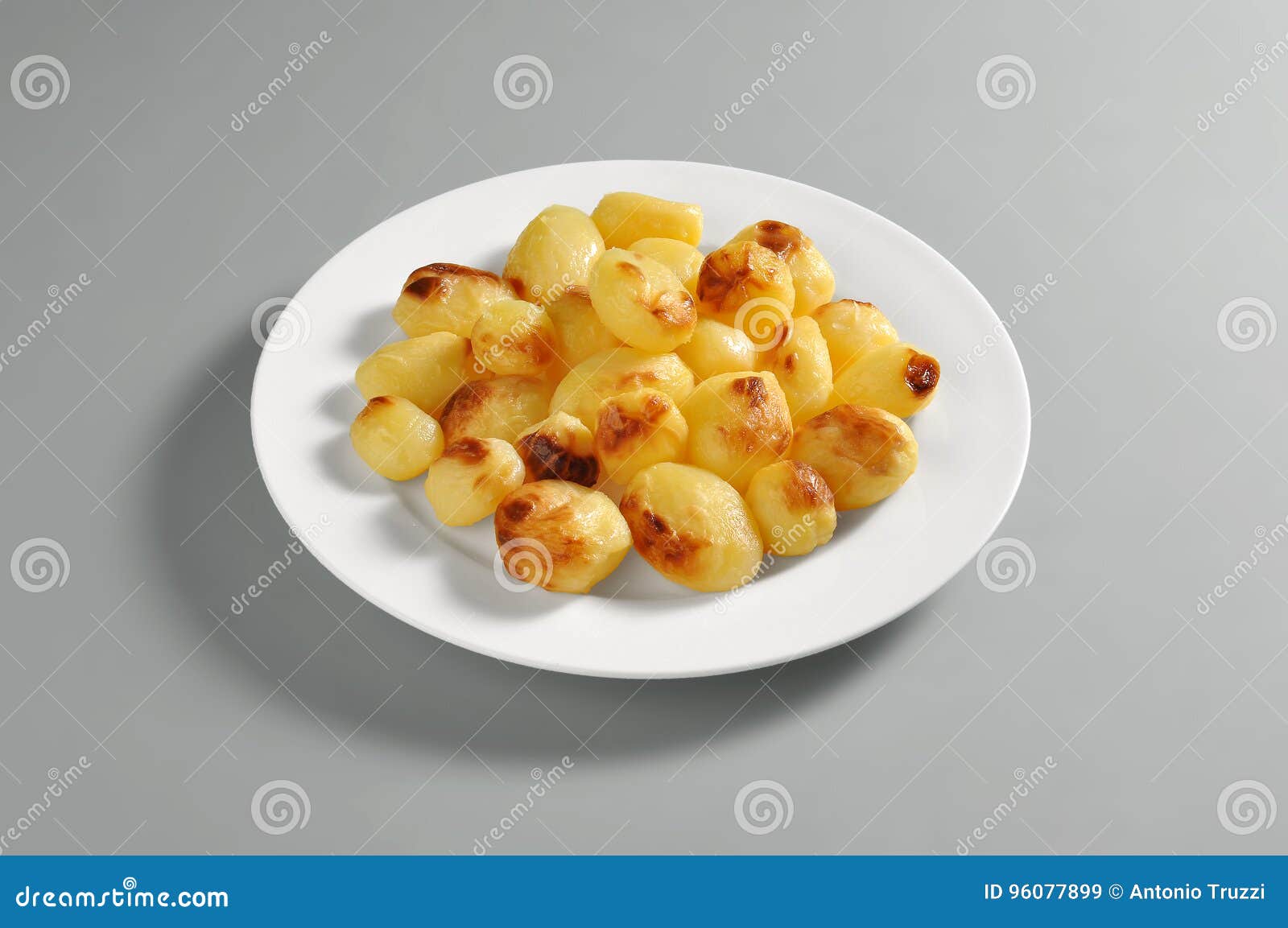 Round Dish with a Portion of Roasted Potatoes Stock Image - Image of ...