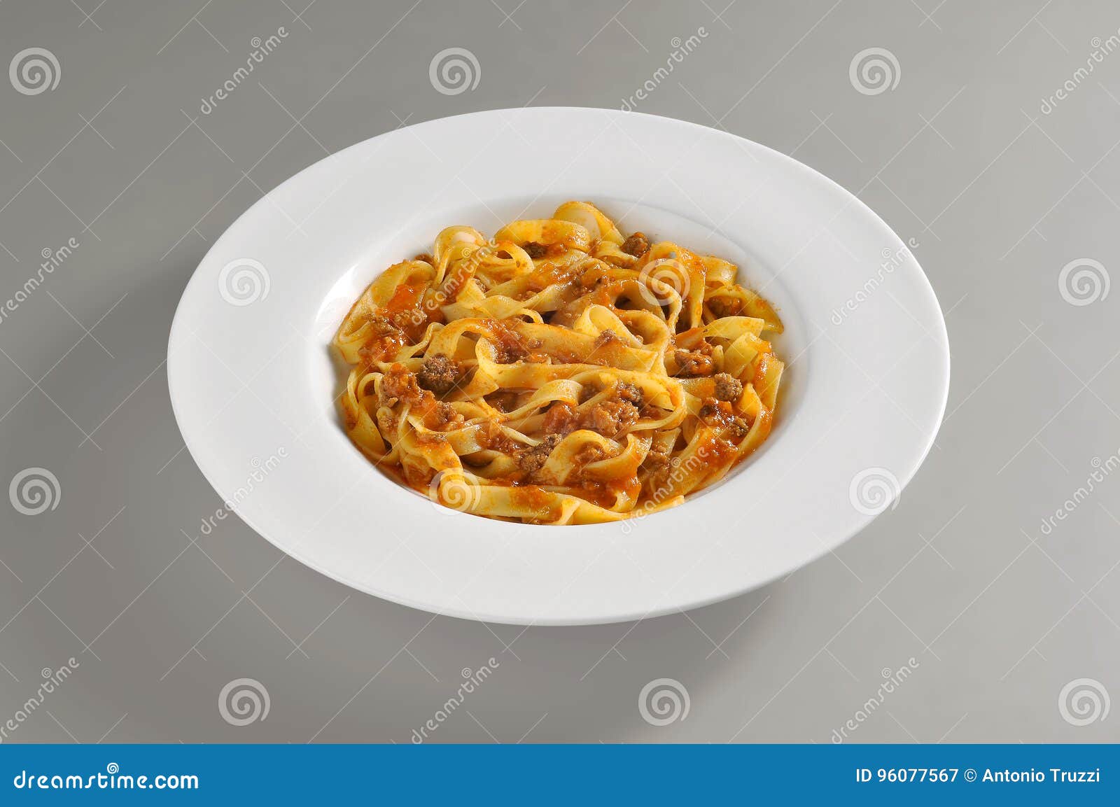 Round Dish with a Serving of Tagliatelle Pasta with Meat Souce Stock ...