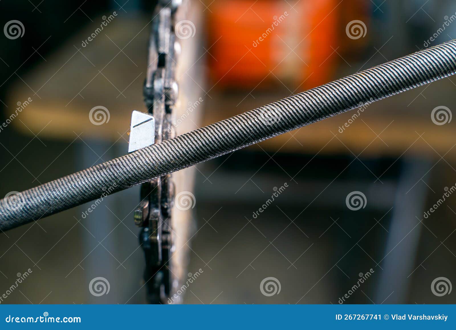 A Round File Sharpens a Saw Chain on a Chainsaw Bar Close-up on a ...