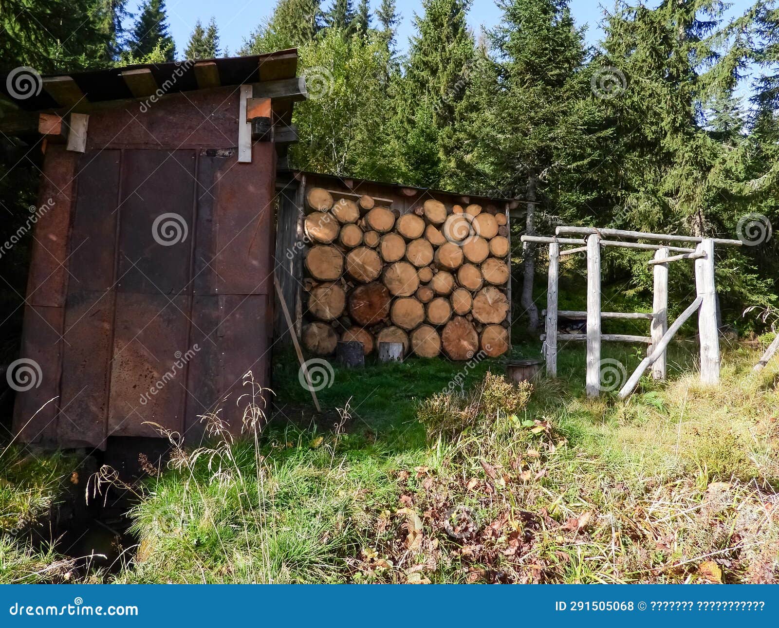 Round Firewood Stacked Under the Wall Forms an Interesting Composition ...