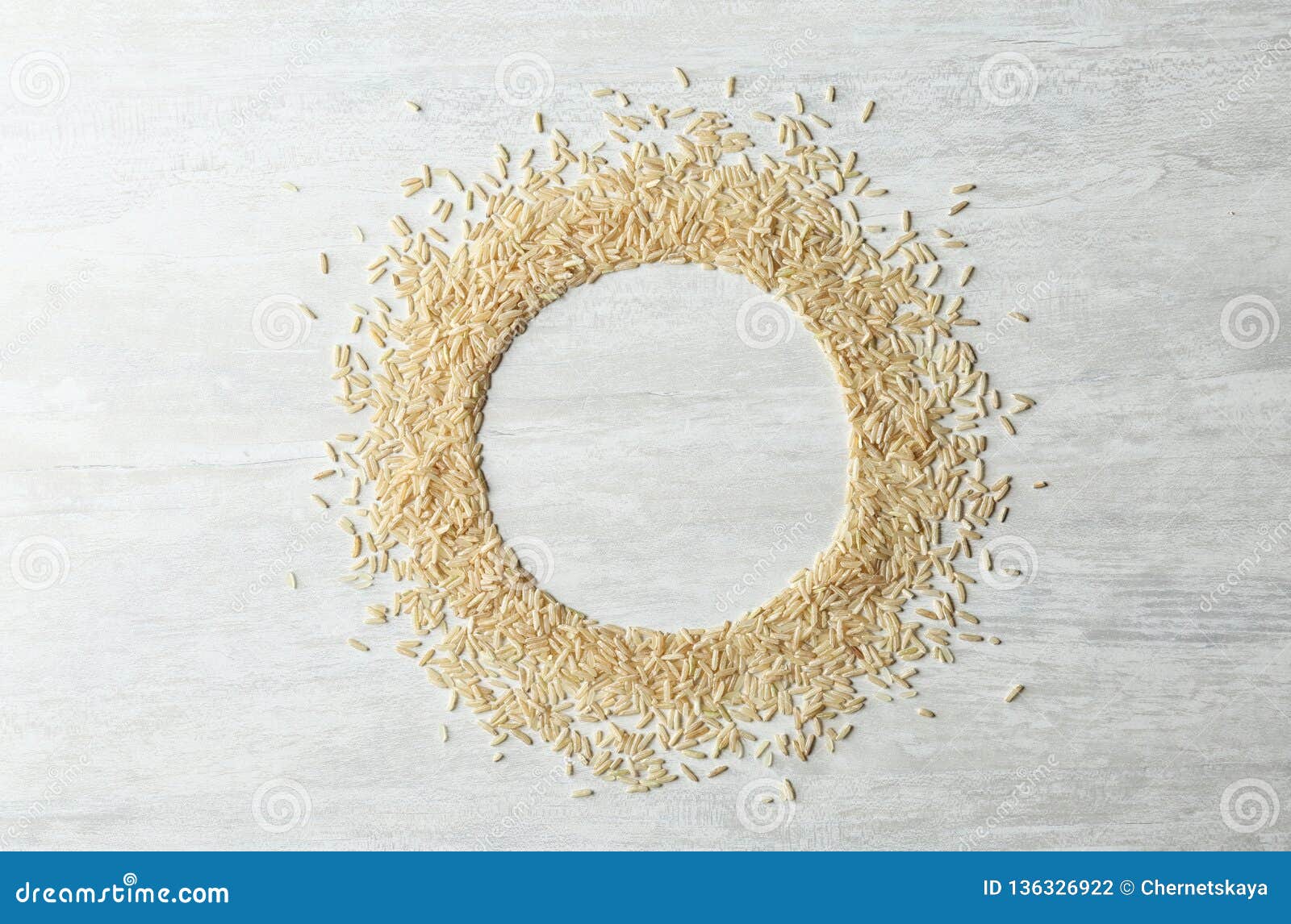 Round Frame Made with Brown Rice on White Background, Top View. Space ...
