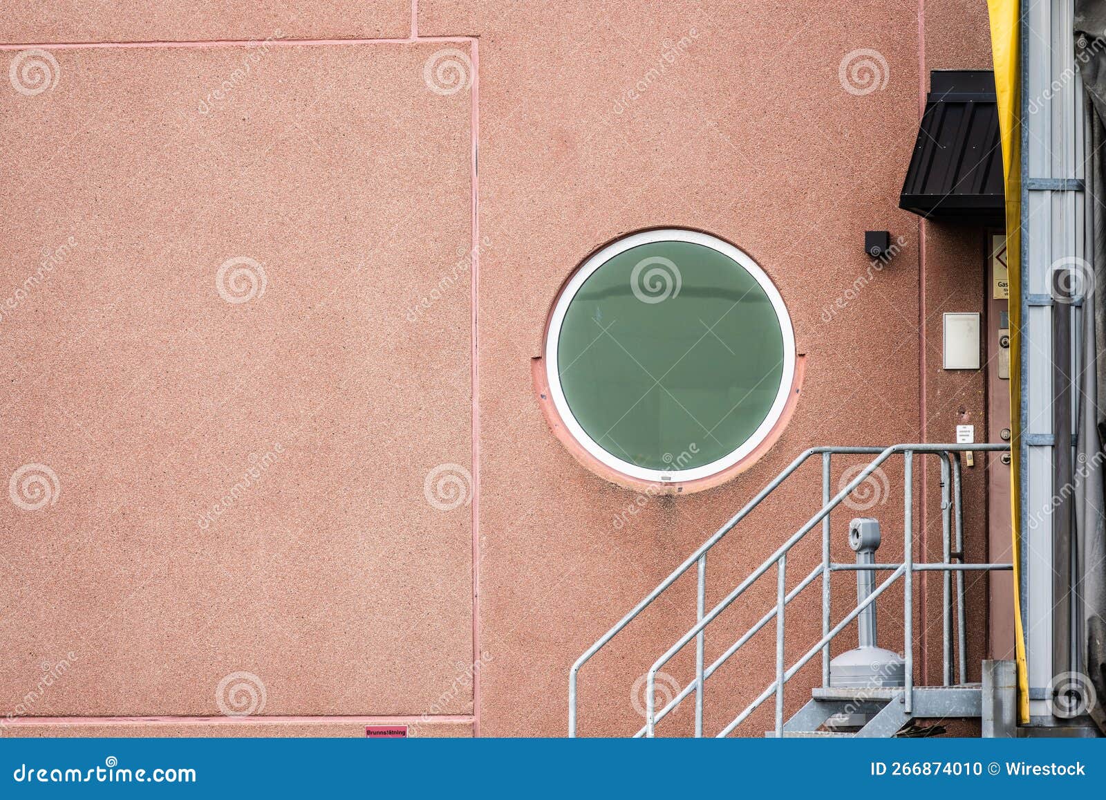 Round Glass Window on a Brown Building Exterior Stock Photo - Image of ...