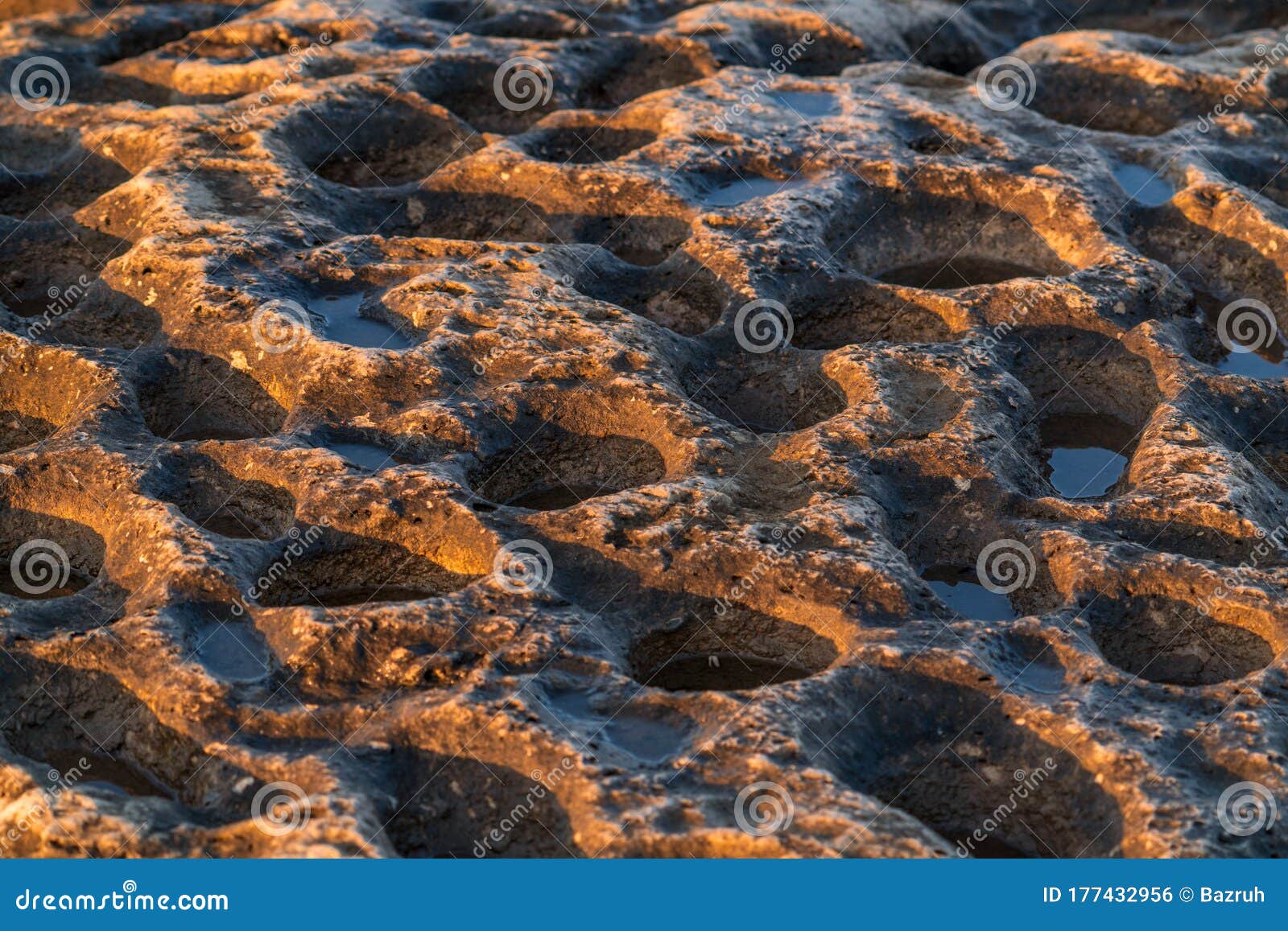 Round Holes with Water in Sedimentary Rock Stock Photo - Image of ...