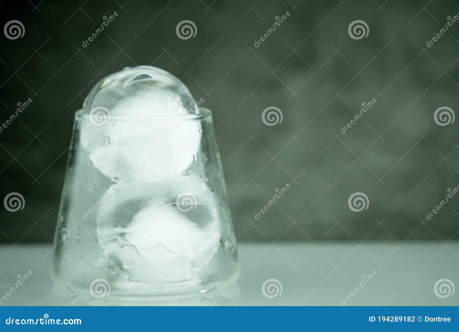 Round Ice Ball in Transparent Glass Stock Photo - Image of black, clean ...