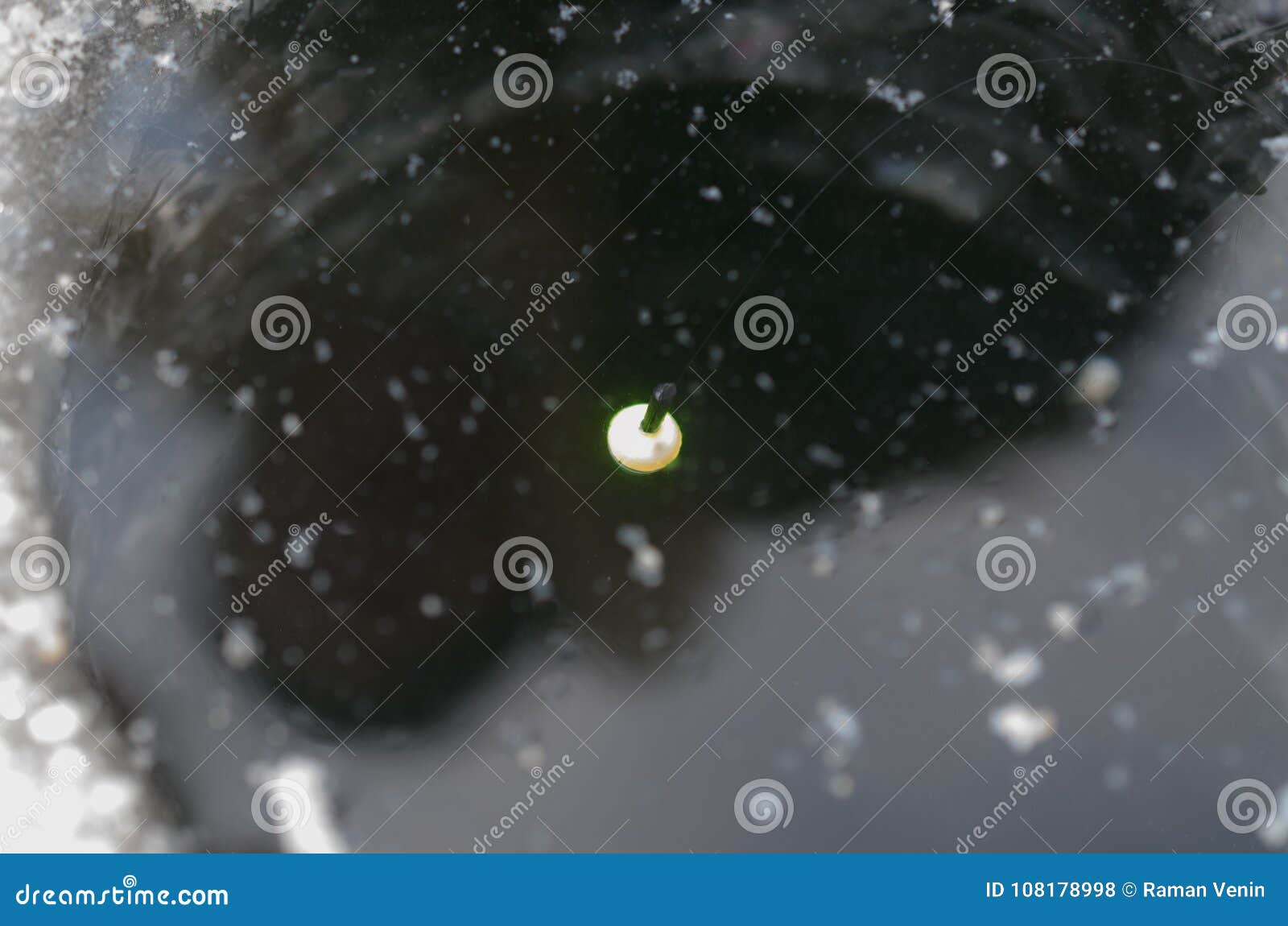 Round Ice in the Ice with a Float on the Line. Stock Photo - Image of ...