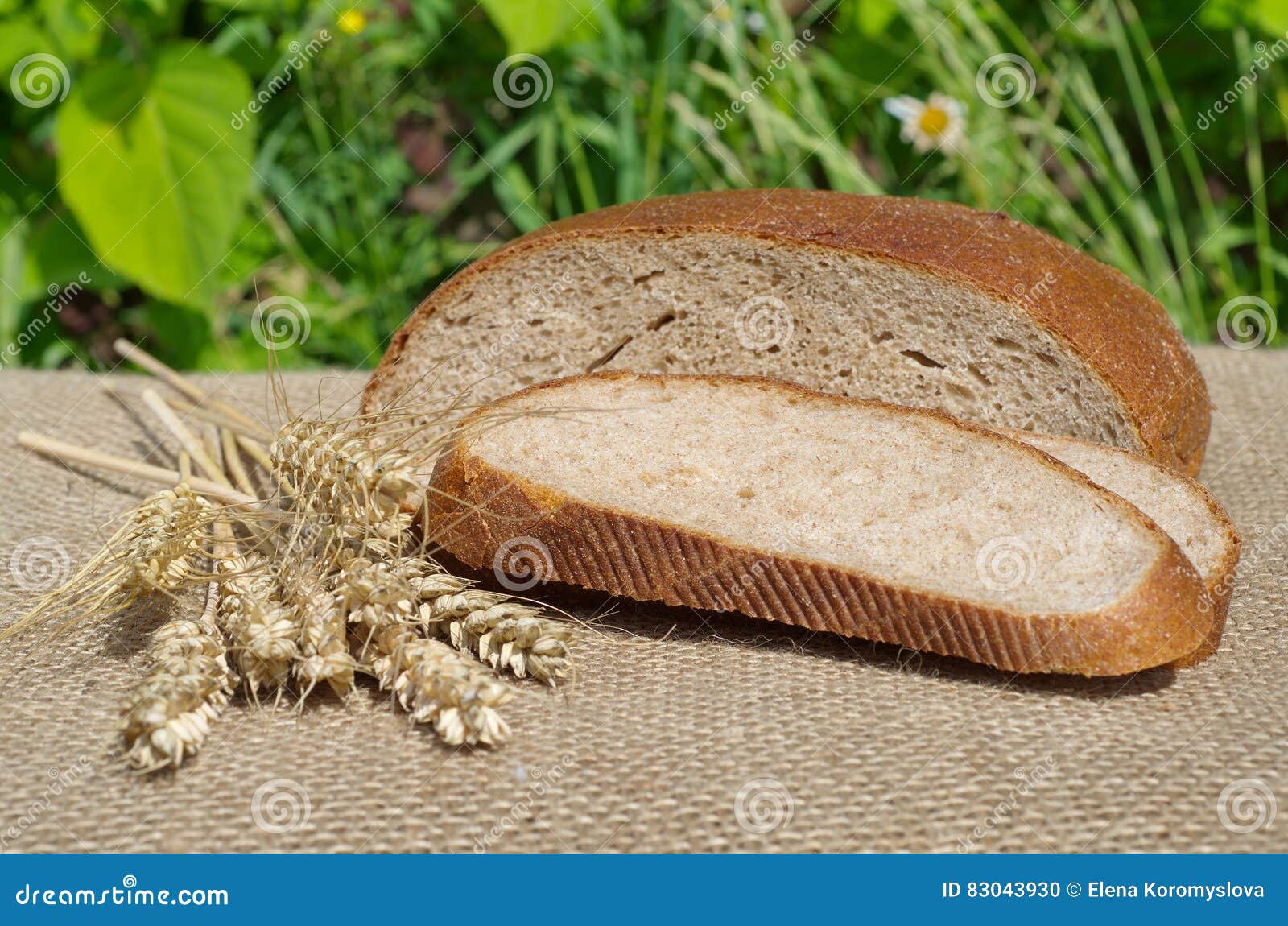 Round Loaf of Rye Bread with a Cut Piece Stock Photo - Image of food ...