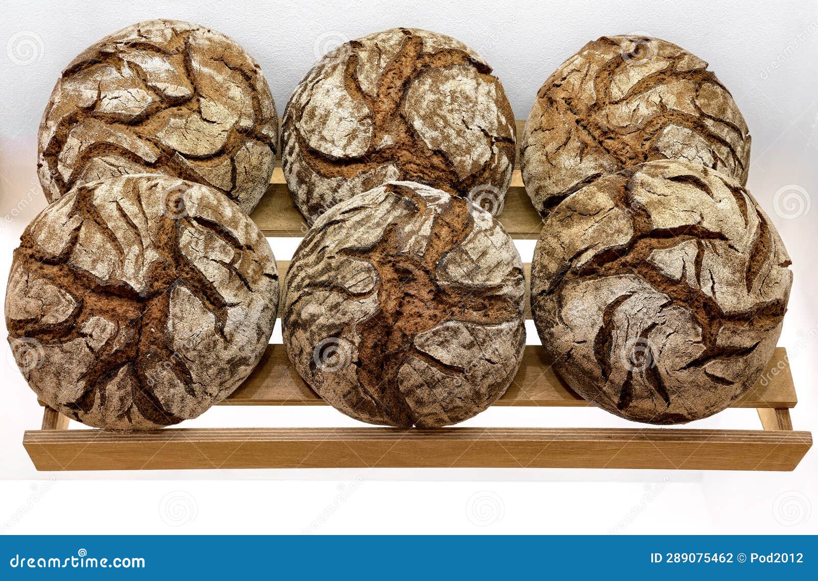 Round Loaves of Dark Rye Bread on Shelf in Bakery. Big Round Bread ...