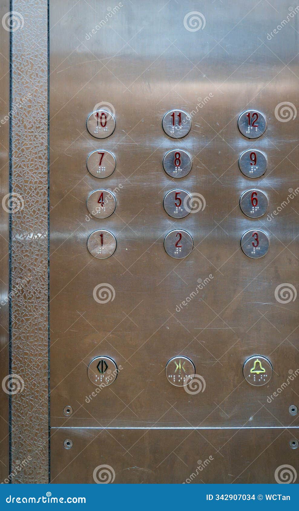 Round Metallic Buttons on an Elevator Control Panel with Signs of Wear ...