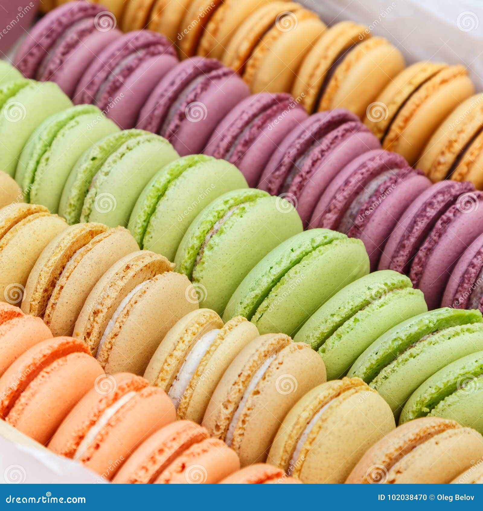 Round Multi-colored Tasty Hand-made Biscuits are Stacked in a Row in a ...