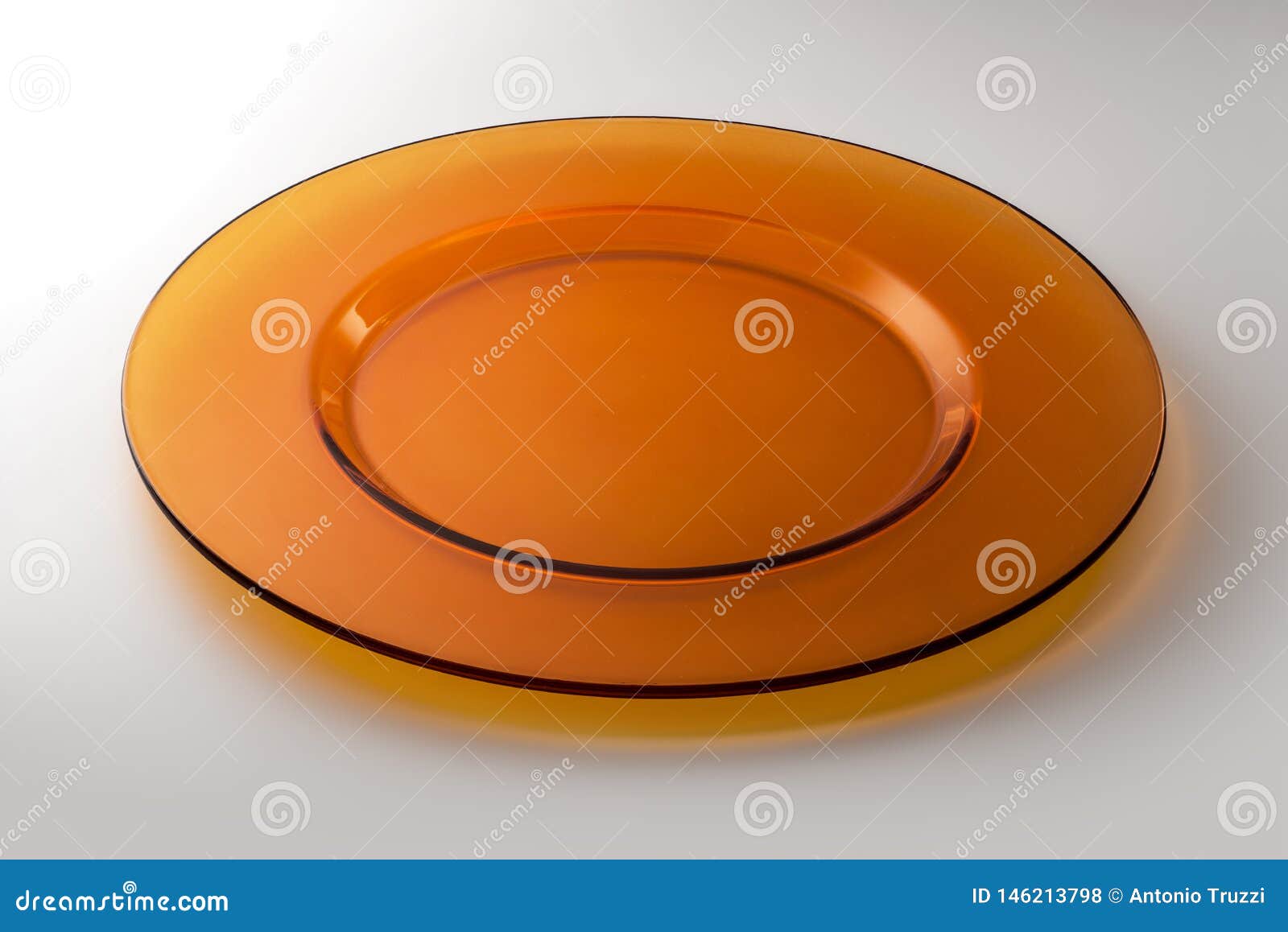 Round Orange Flat Plate in Transparent Crystal Stock Photo - Image of ...