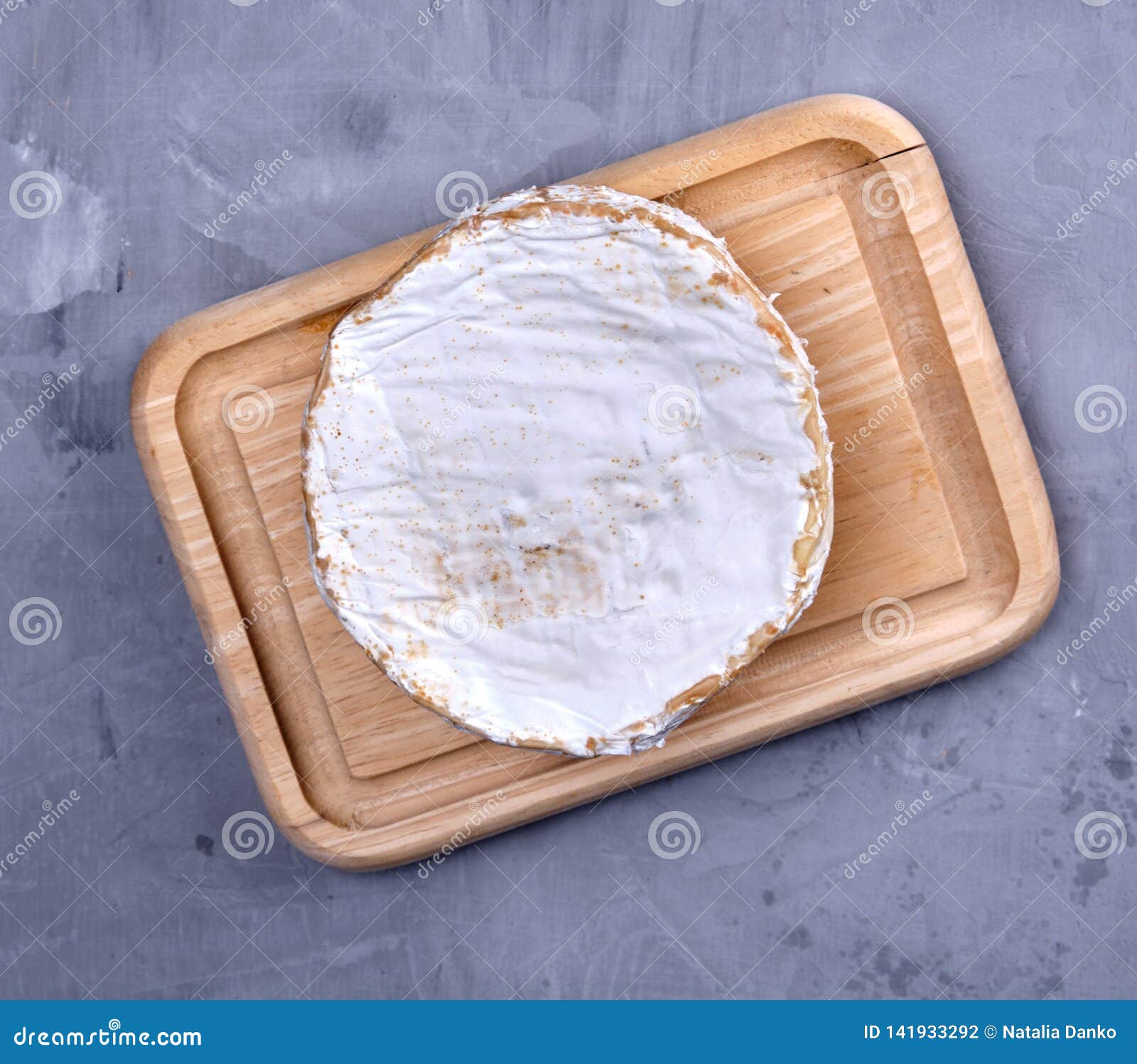 Round Piece of Brie Cheese on a Wooden Board Stock Photo - Image of ...