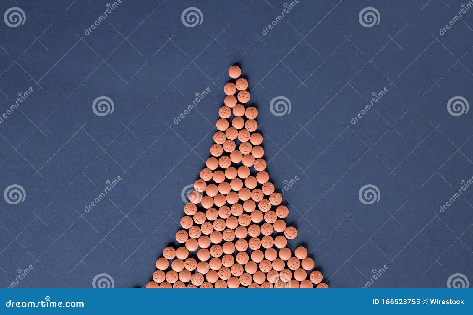Round Pills Placed in a Triangle Shape on a Blue Background - Great for ...