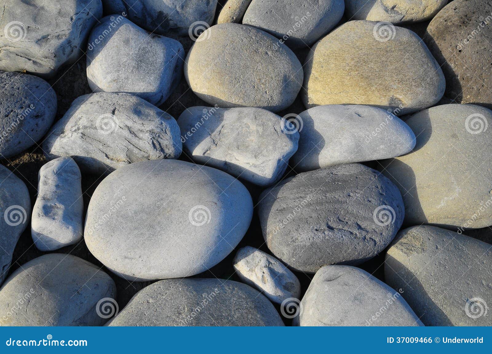 Round Rocks Smoothed by the Water Stock Photo - Image of coast, stones ...