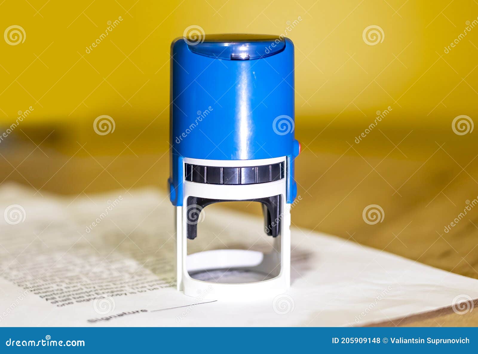 Round Rubber Stamp on Document on Wooden Table Stock Photo - Image of ...