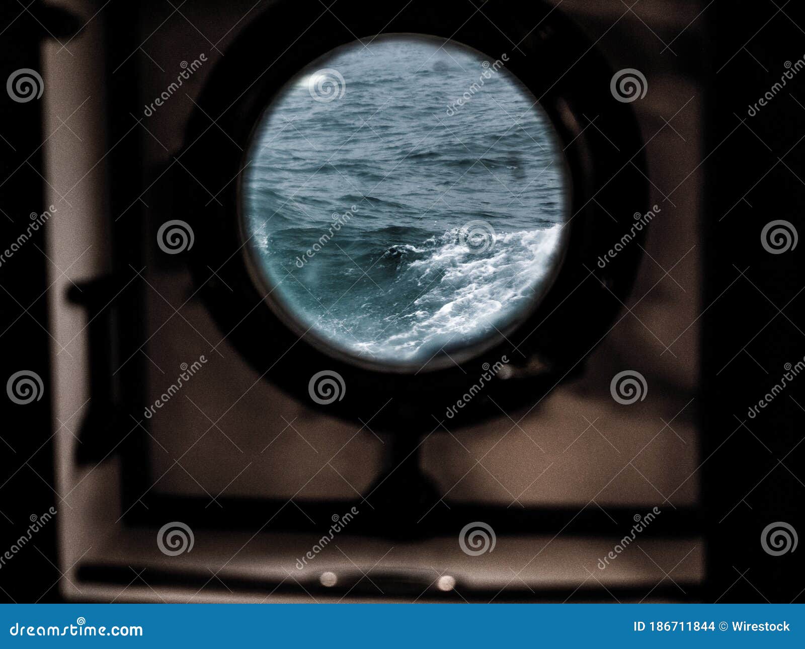 Round Ship Window with Brown Edges and the Wavy Sea Seen through it ...