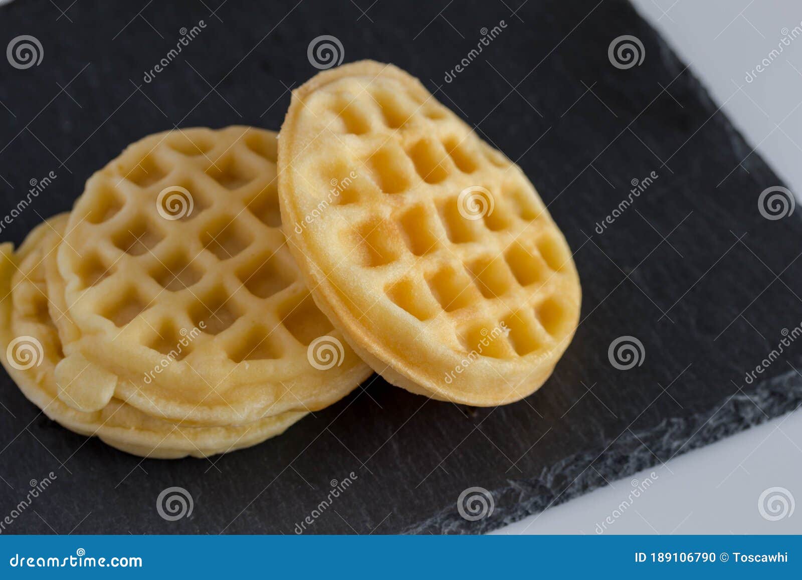 Round Small Waffles On Black Slate Background Waffles With Copy Space ...