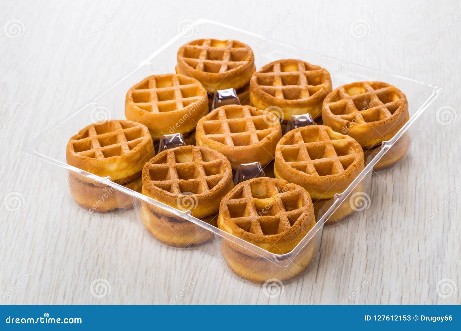 Round Small Waffles in Plastic Transparent Container on Table Stock ...
