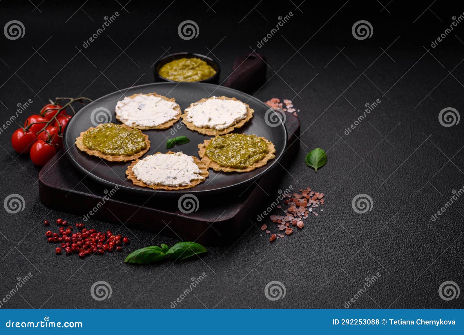 Round Snacks with Crispy Chips or Crackers with Cream Cheese and Pesto ...
