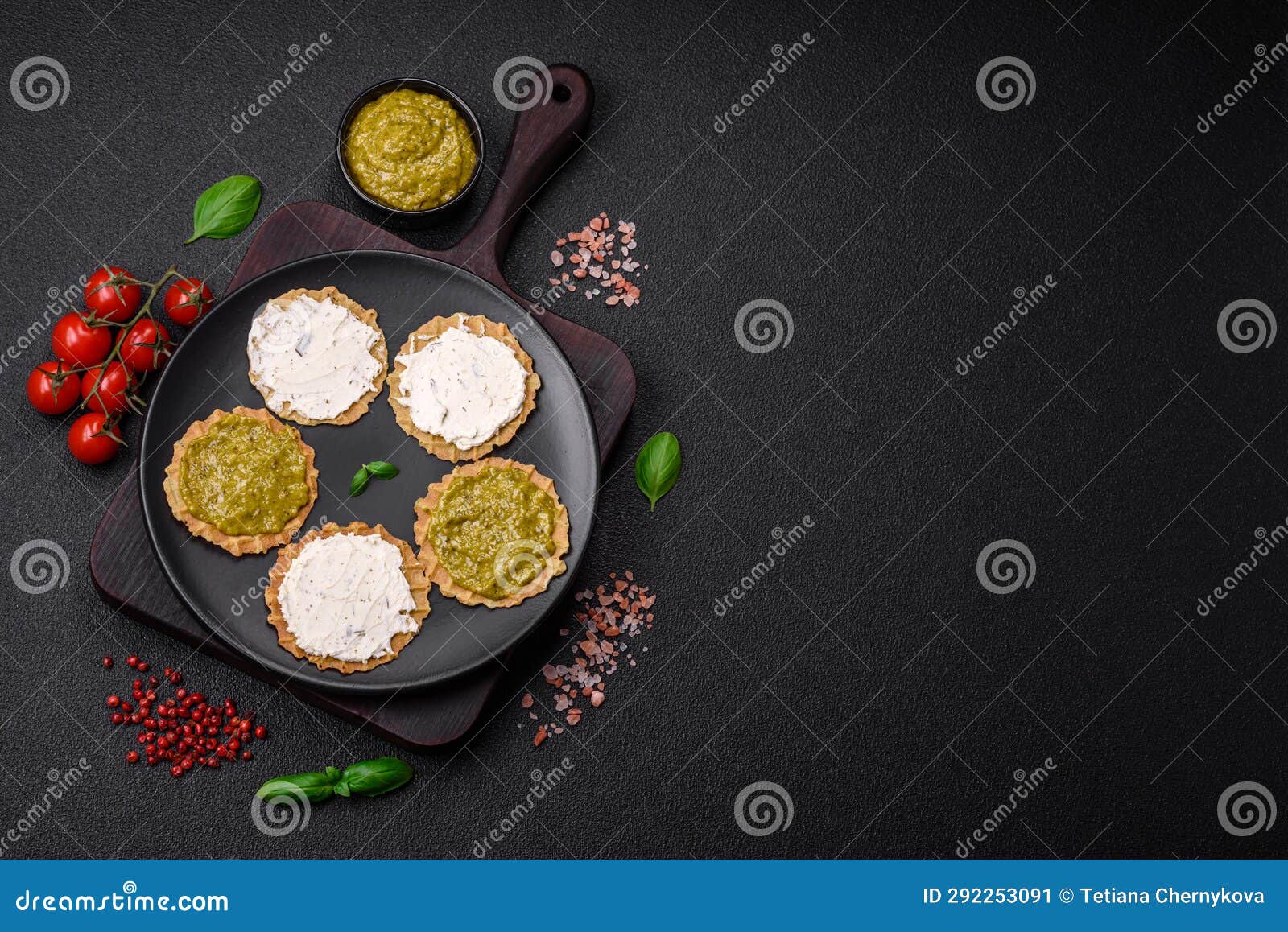 Round Snacks with Crispy Chips or Crackers with Cream Cheese and Pesto ...