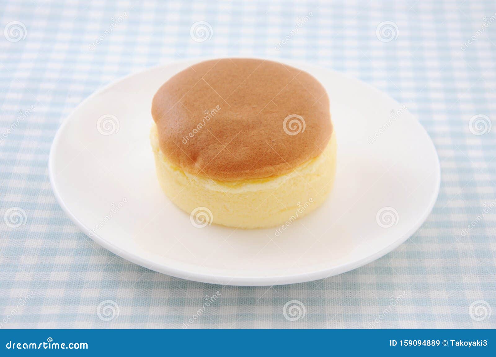 Round Sponge Cake on Plate on Table Stock Image - Image of table ...
