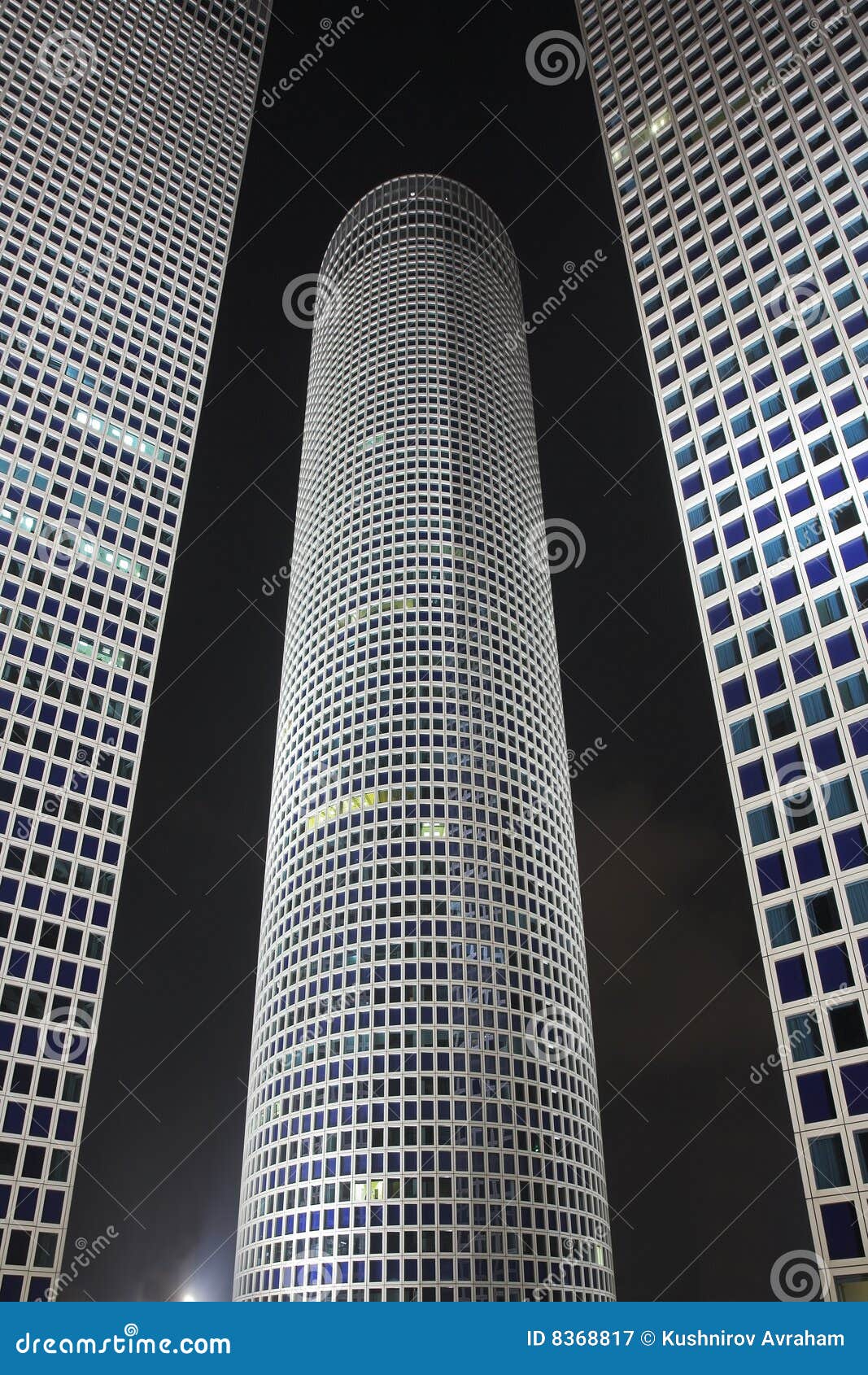 Round, Square and Triangular Skyscrapers at Night Stock Image - Image ...