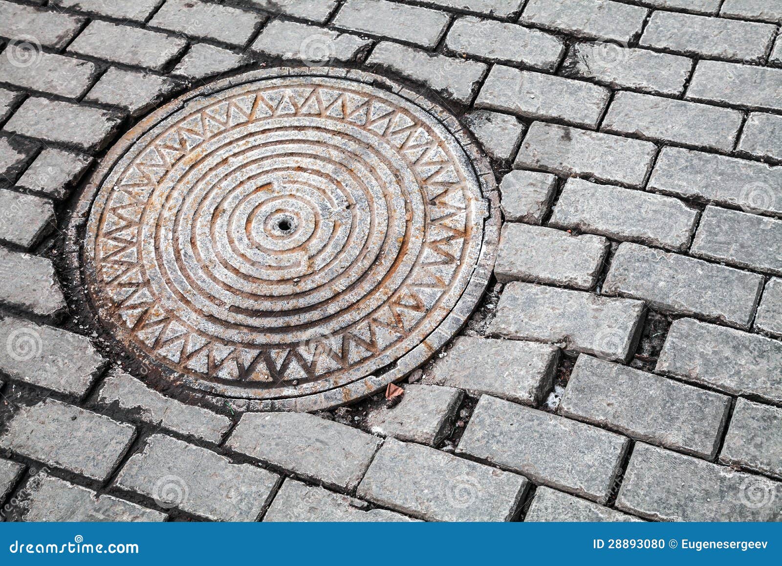 Round Steel Sewer Manhole on Old Stone Road Stock Photo - Image of iron ...
