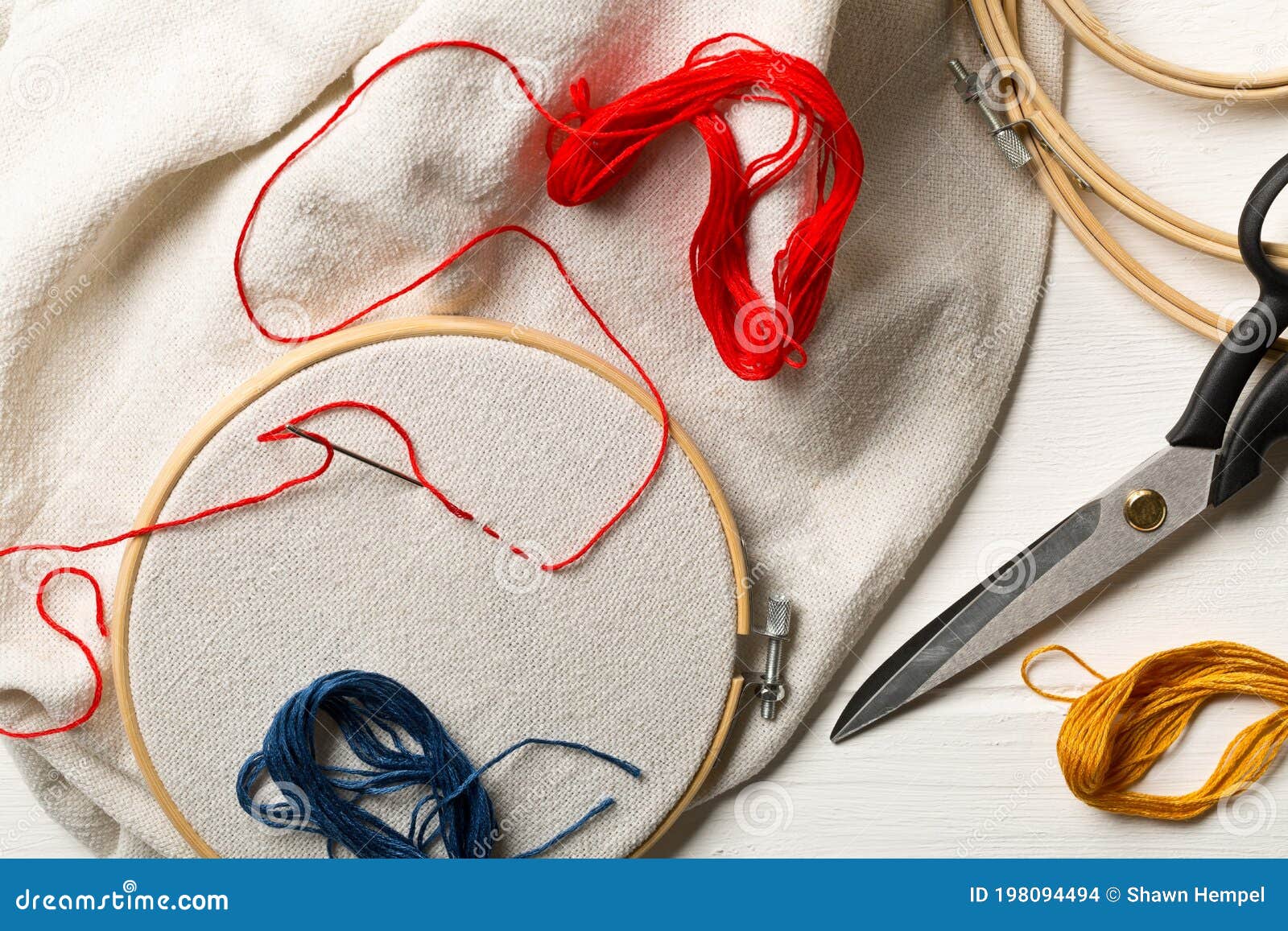 Round Stitching or Embroidery Frame with Red Stitching and Sewing Tools ...