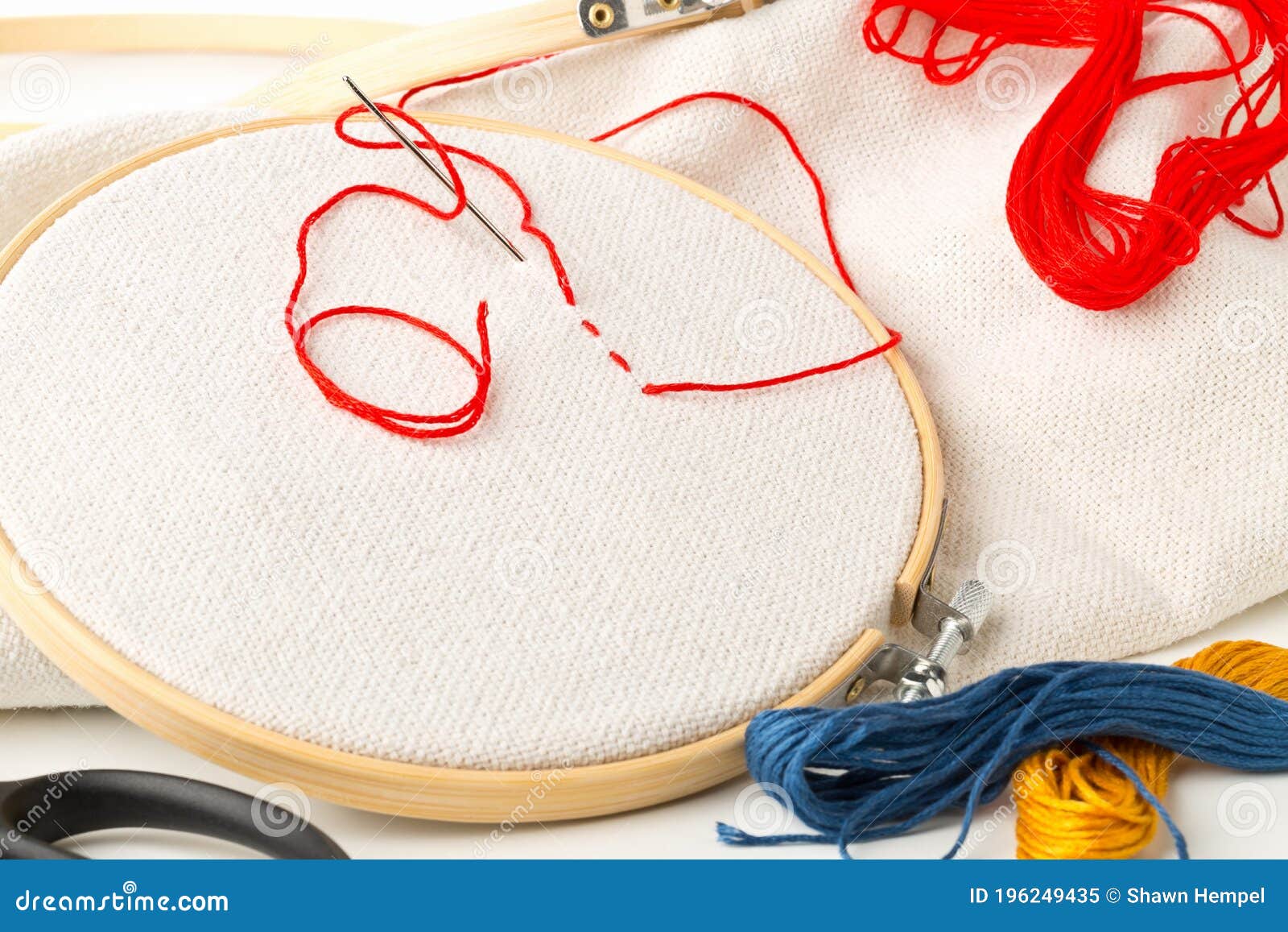 Round Stitching or Embroidery Frame with Red Stitching and Sewing Tools ...