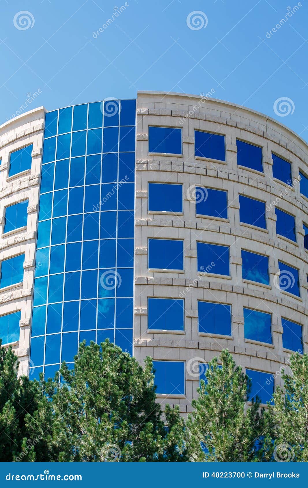 Round Stone Building with Blue Windows Stock Photo - Image of tall ...