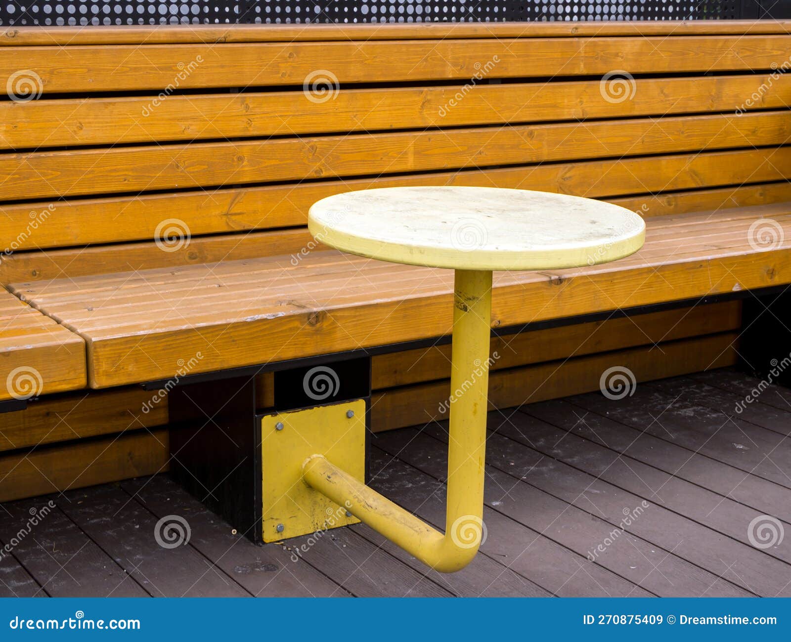 Round Table Attached To a Bench on a Corner Support Stock Image - Image ...