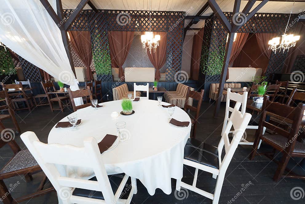 Round table in restaurant stock image. Image of hall - 30983697