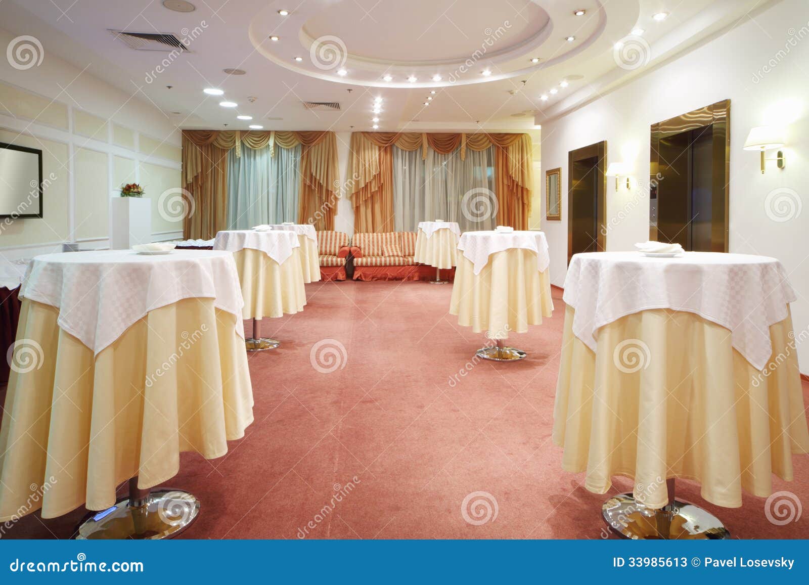 Round Tables with White Tablecloths and Sofas in Buffet Stock Image ...