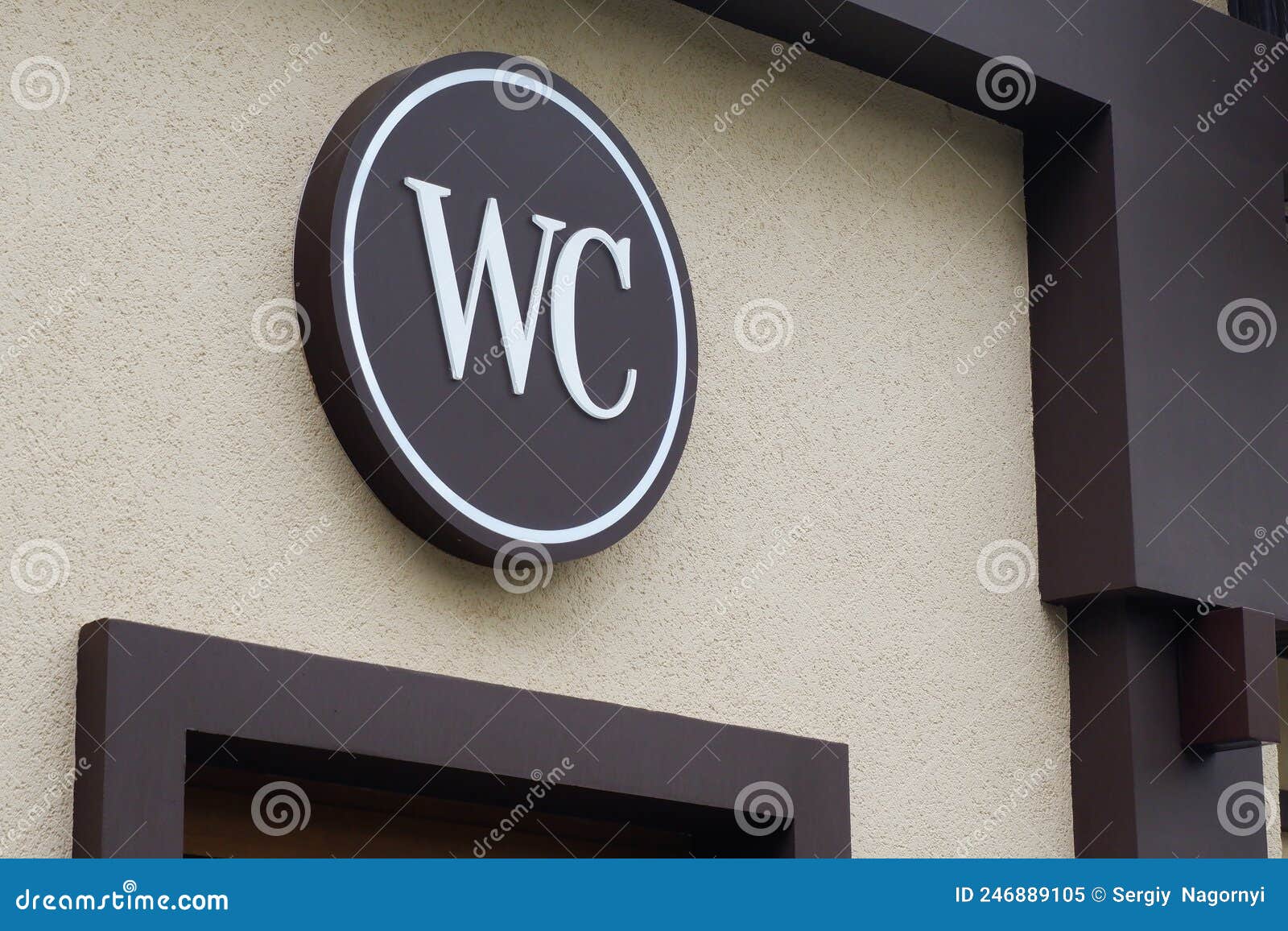 Round Toilet Sign on a Building Facade Stock Image - Image of bathroom ...